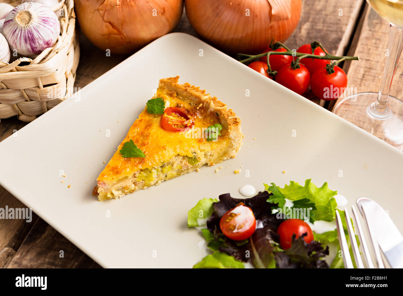 Slice of quiche lorraine - french kitchen Stock Photo - Alamy