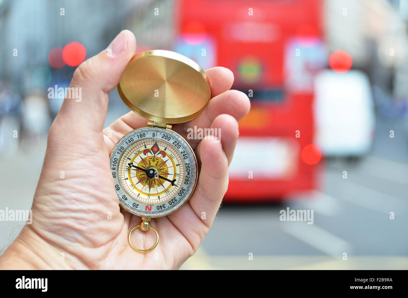 Compass in the hand on a street of London Stock Photo - Alamy