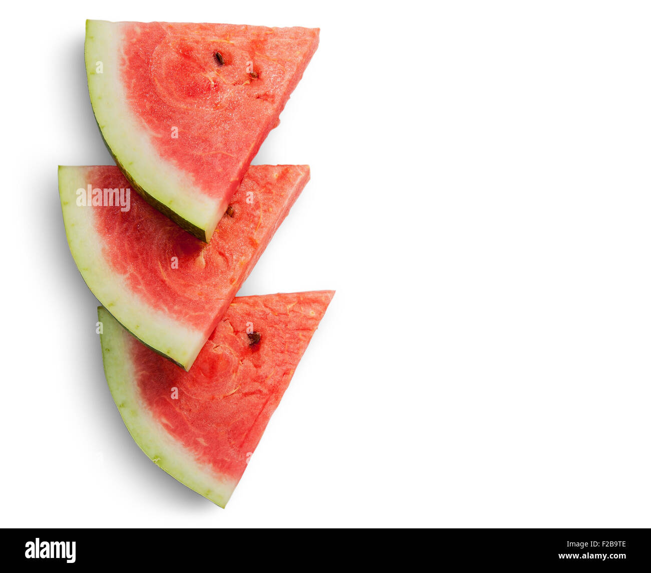 Three slices of watermelon on each other isolated on white background ...