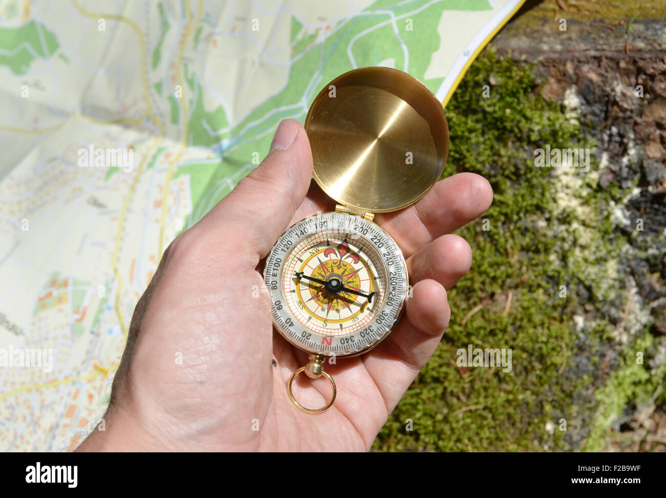 Compass in the hand Stock Photo - Alamy