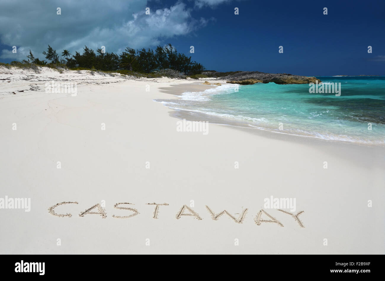 Castaway writing on a desrt beach of Little Exuma, Bahamas Stock Photo ...