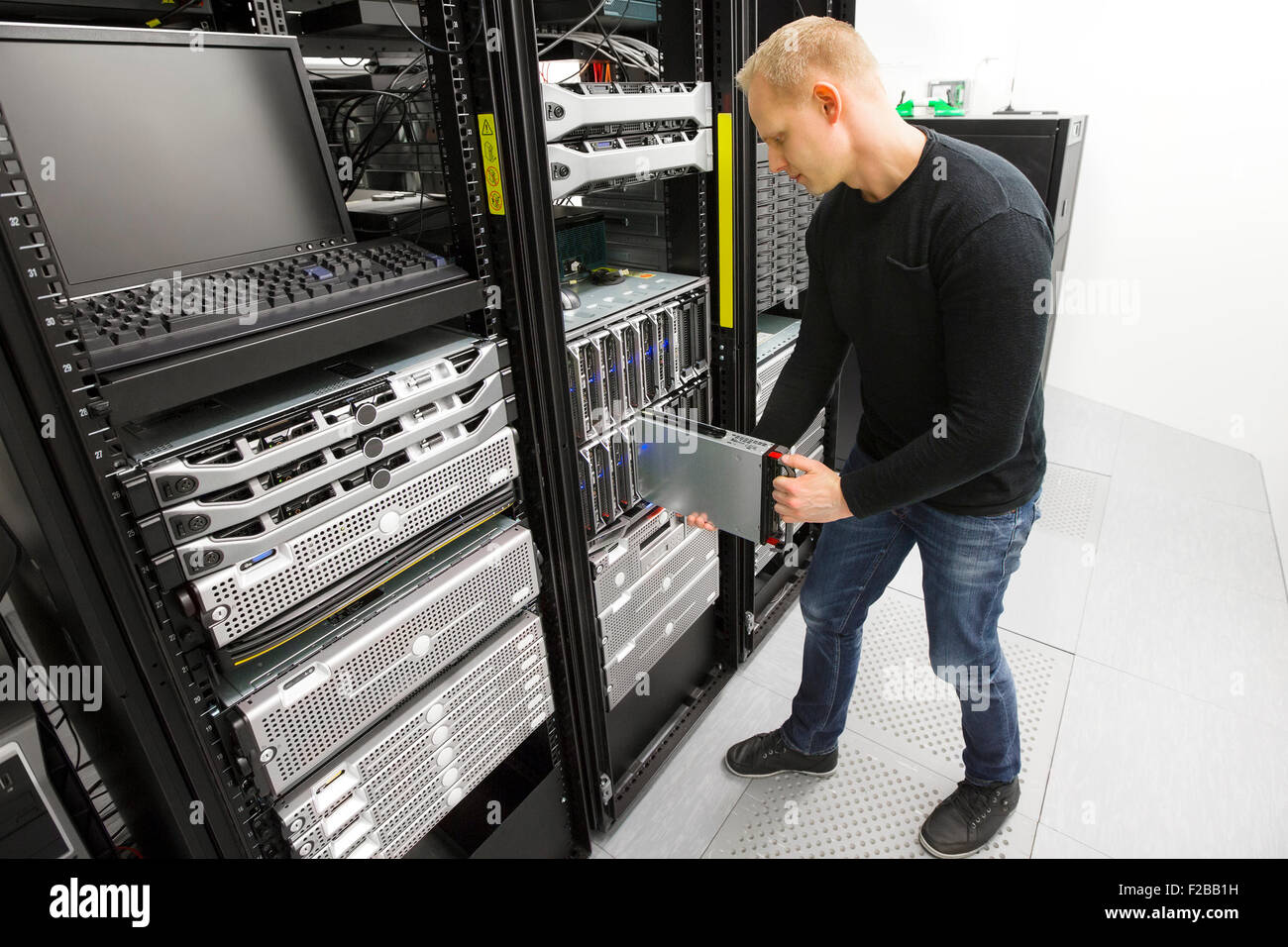 It Engineer Installs Blade Server In Datacenter Stock Photo Alamy