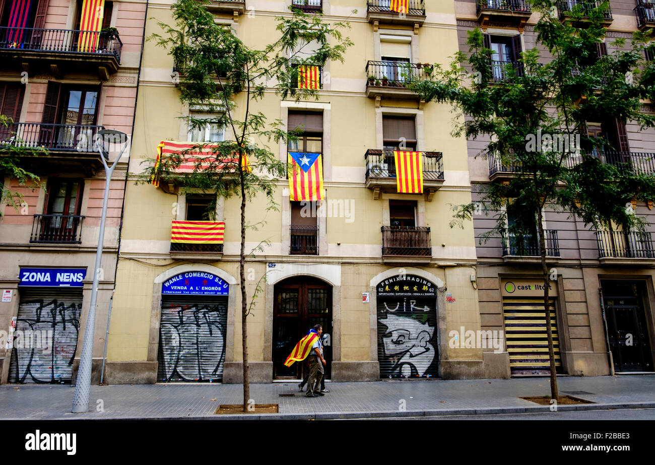 Two men draped in the Estelada (Catalonian Independence Flag) on their ...
