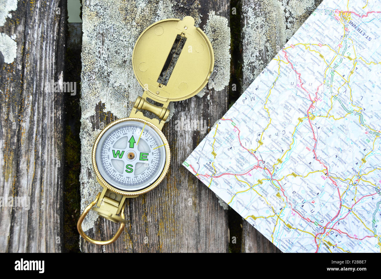 Compass and map Stock Photo - Alamy