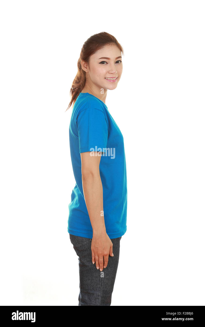 young beautiful female with blue t-shirt (side view) isolated on white ...