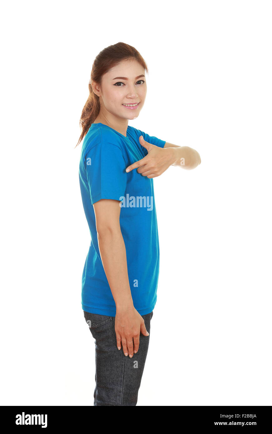 young beautiful female with blue t-shirt (side view) isolated on white ...