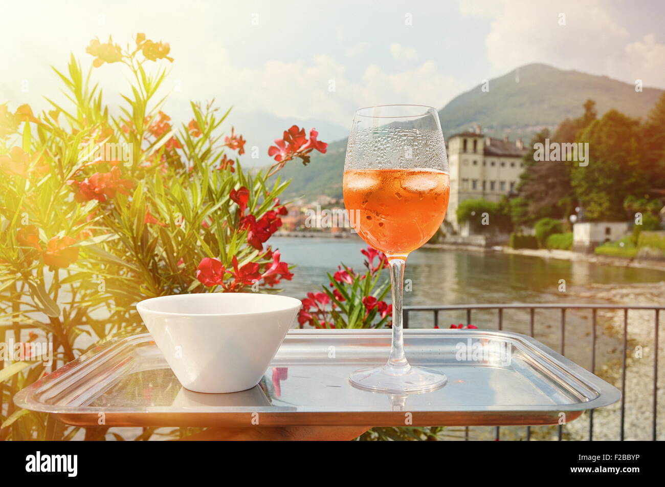 Traditional Italian Spritz cocktail against lake Como, Italy Stock ...