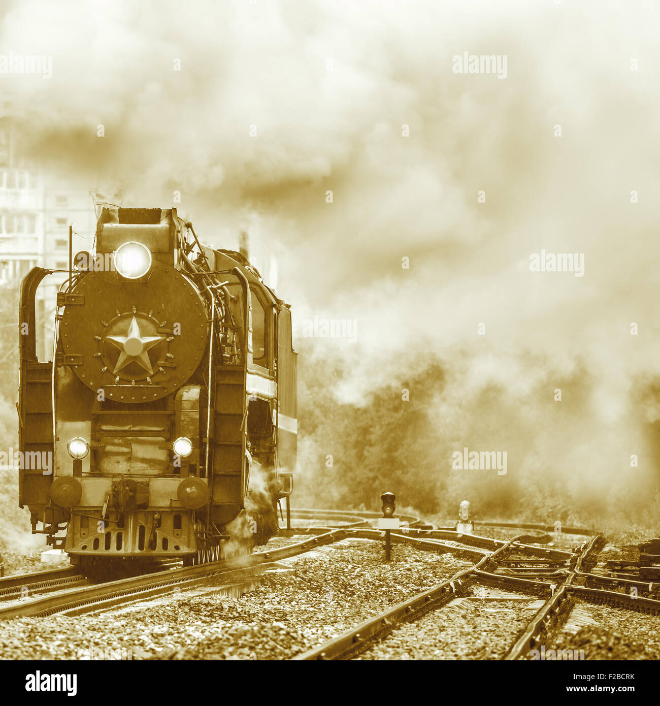 Old retro steam locomotive moves under the pouring rain Stock Photo - Alamy