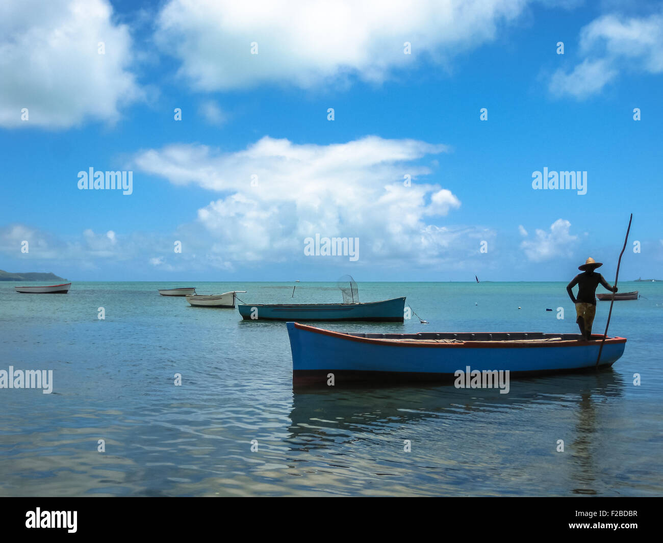 Fisherman on a boat Stock Photo - Alamy