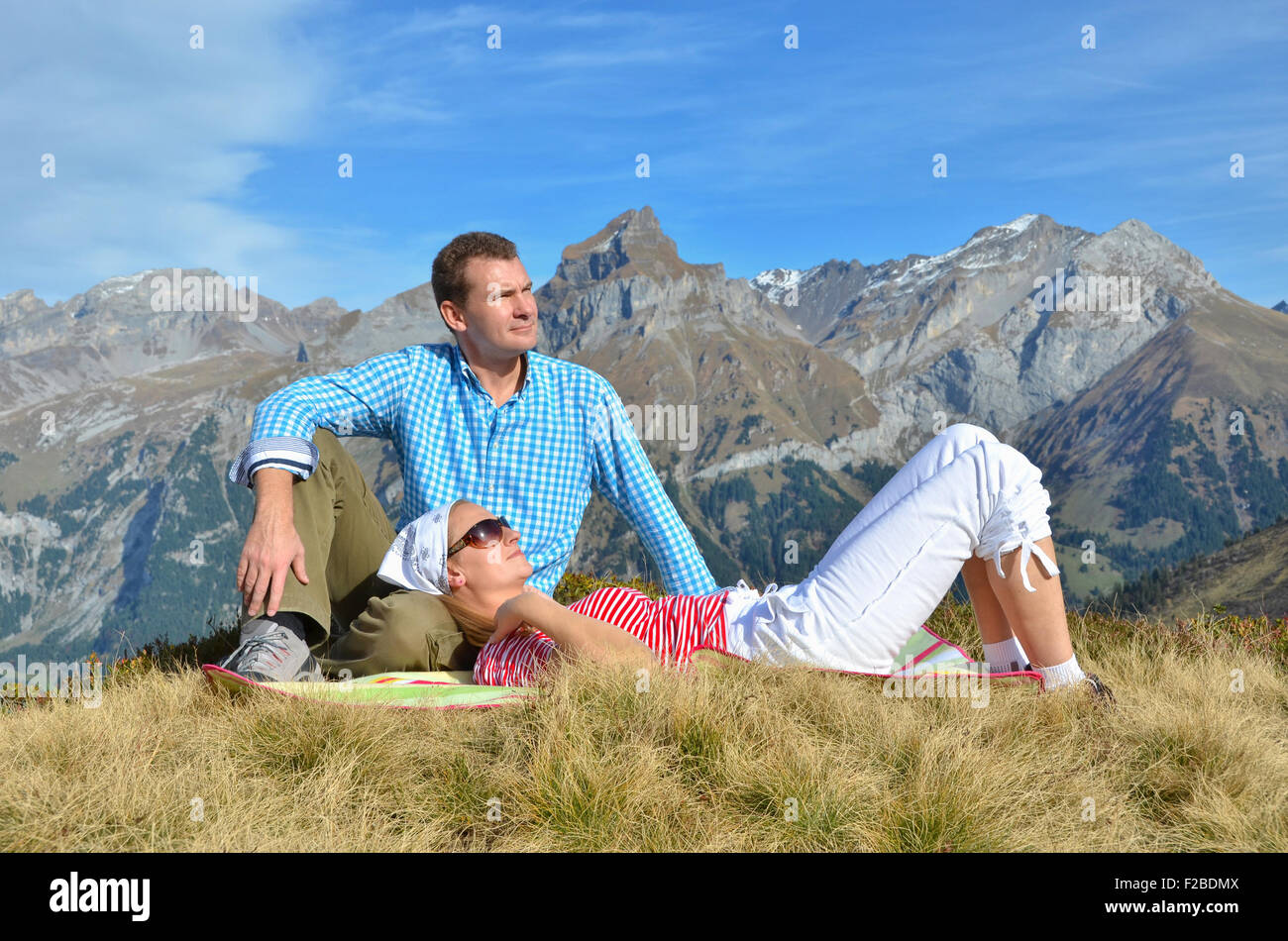 Young couple enjoying Alpine panorama. Switzerland Stock Photo - Alamy