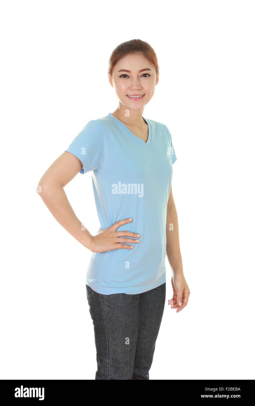 young beautiful female with blue t-shirt (side view) isolated on white ...