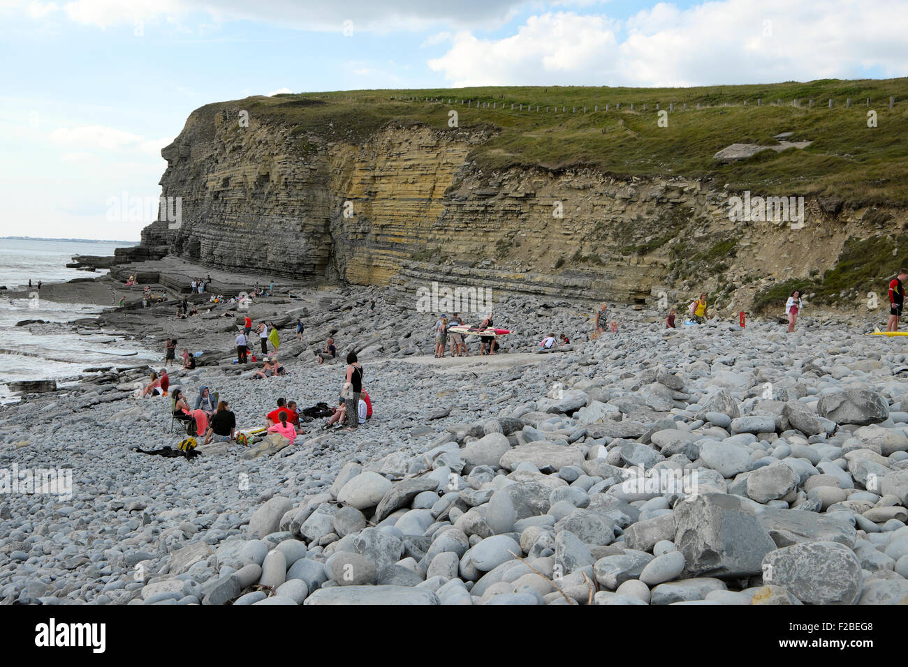 People on the stony beach at Southerndown, Dunraven Bay Wales UK KATHY ...