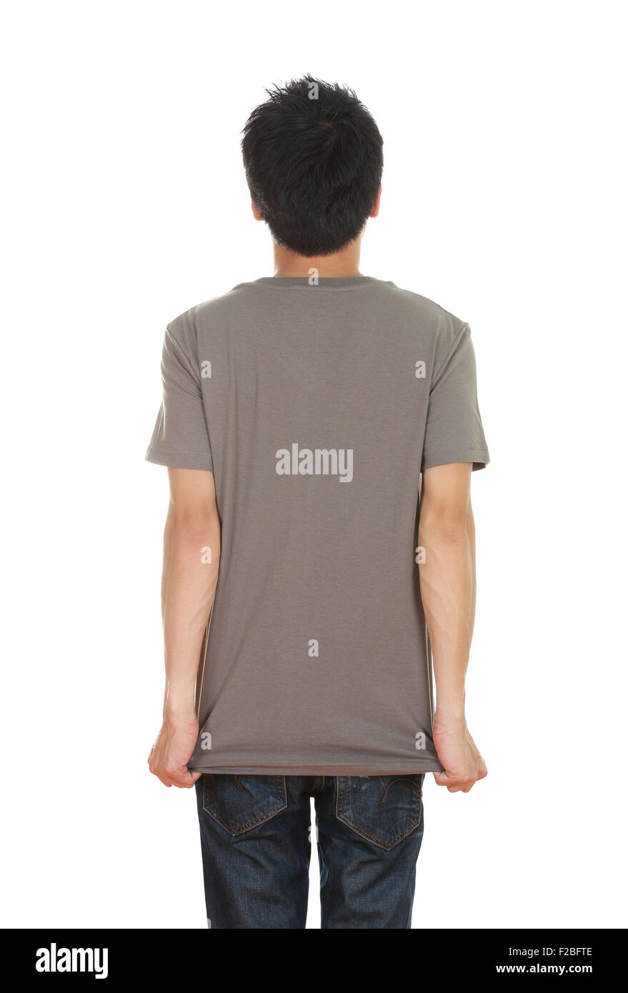 man with blank brown t-shirt (back side) isolated on white background ...