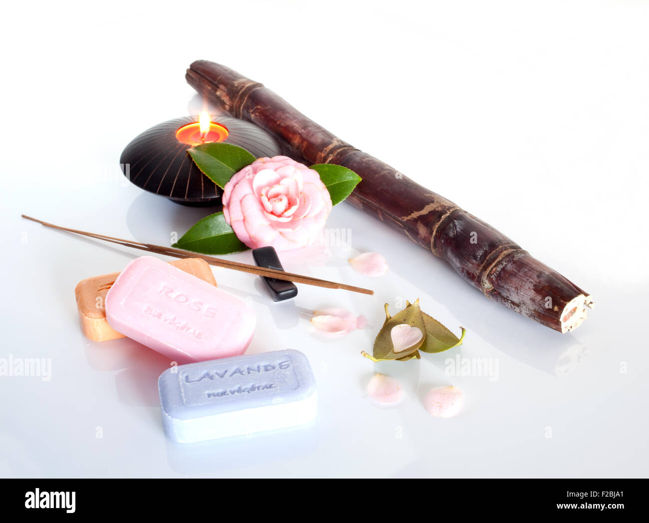 Incense, flower and soap on white Stock Photo - Alamy
