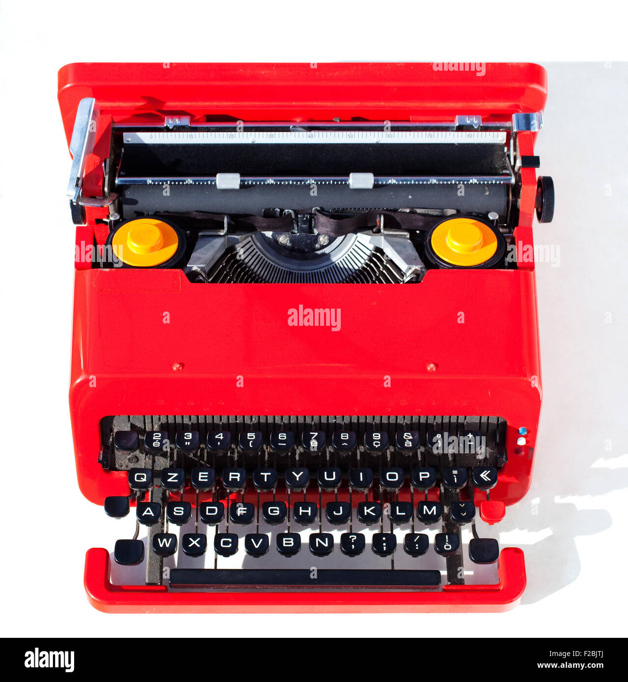 Old red typewriter isolated on a white background Stock Photo - Alamy