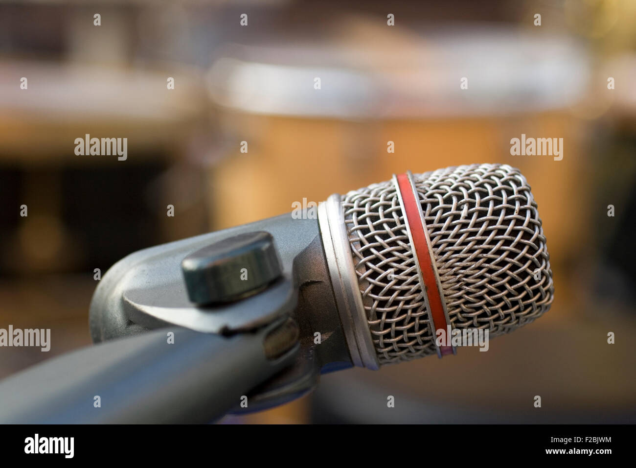 Professional recording microphone on shock mount whit blurred ...