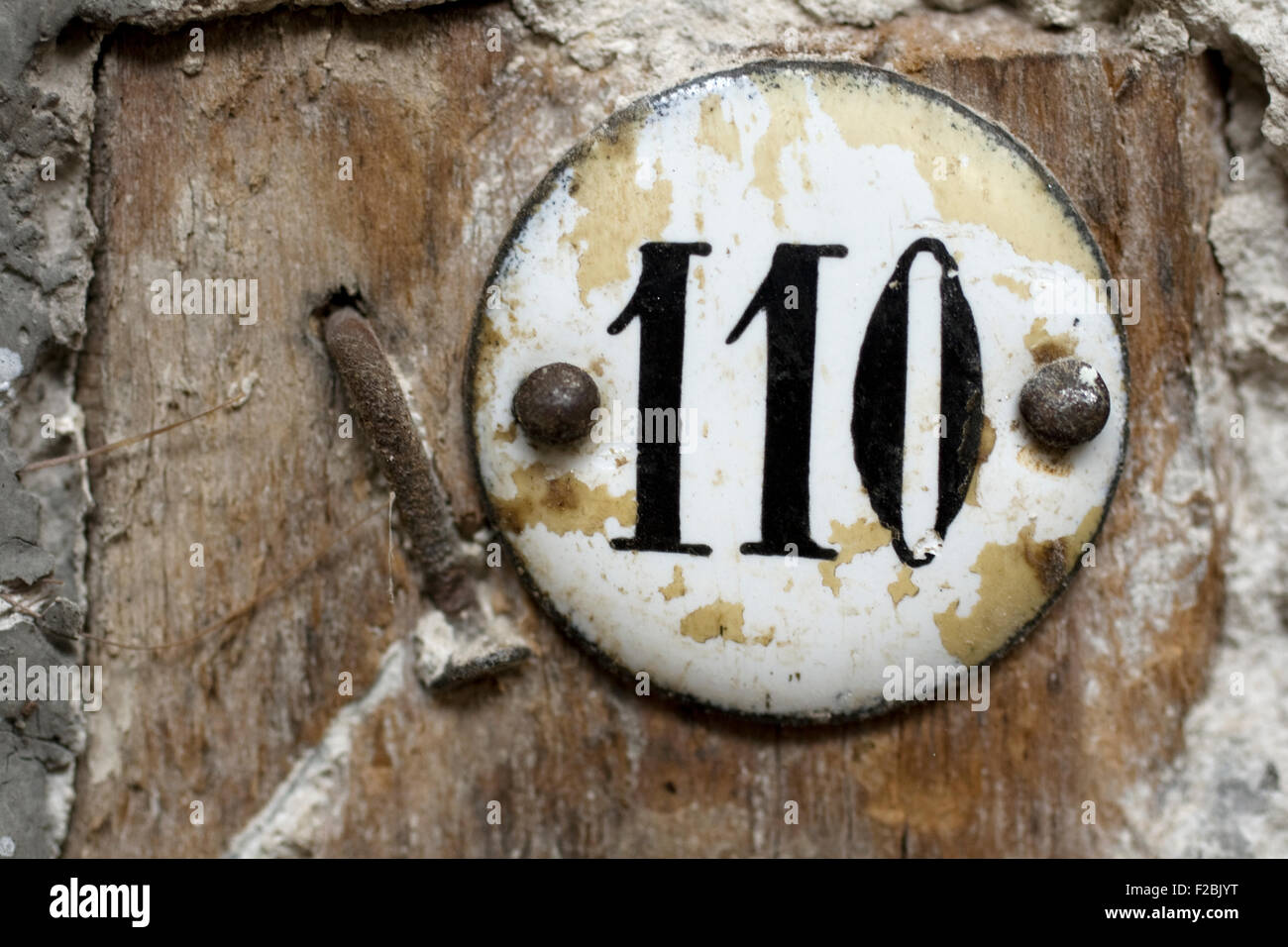 Numbers on a white plaque Stock Photo - Alamy