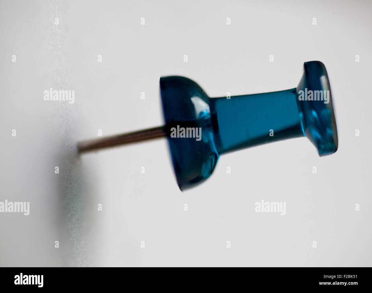 Push pins on paper and wood Stock Photo - Alamy
