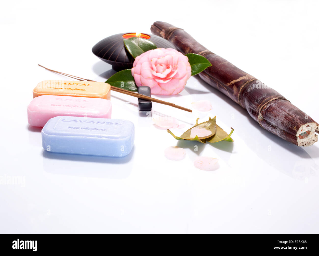 Incense, flower and soap on white Stock Photo - Alamy