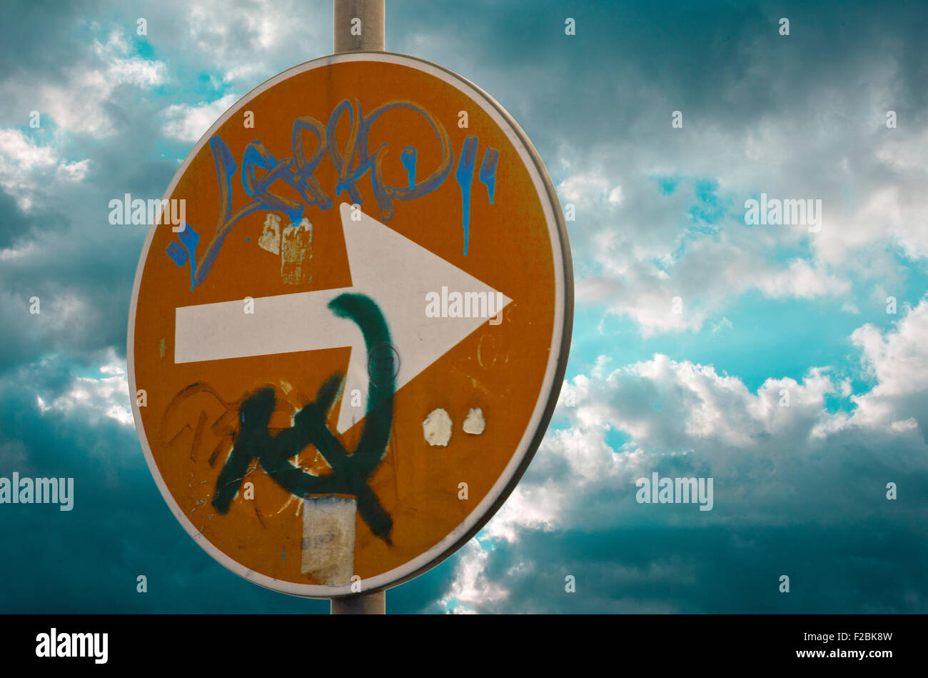 Orange Traffic Direction Signal on the sky Stock Photo - Alamy