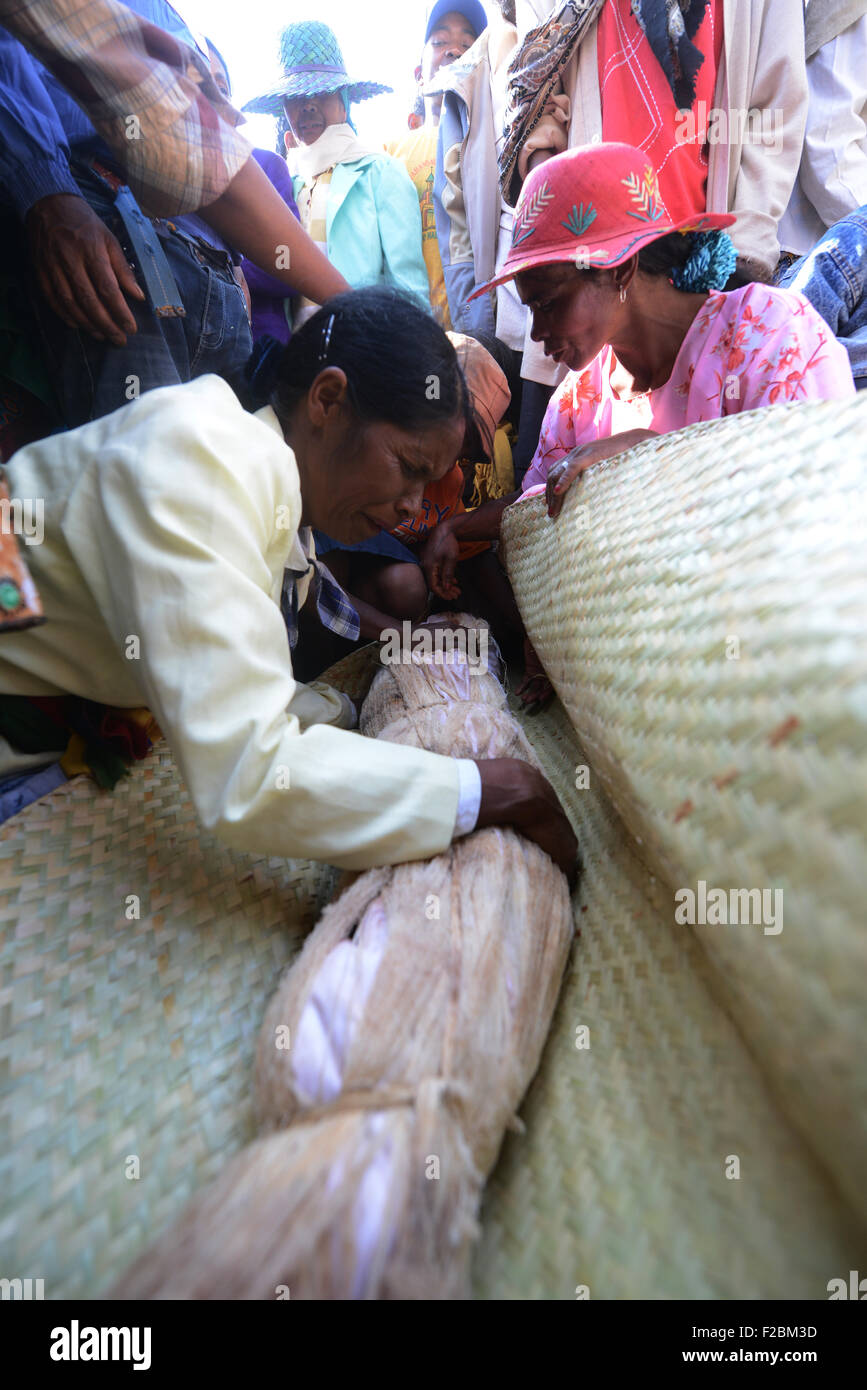 Crying over her mother's corpse. Famadihana ( turning of the bones ...