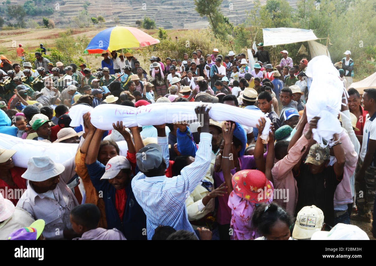 A body is carried into the tomb. Famadihana ( turning of the bones ...