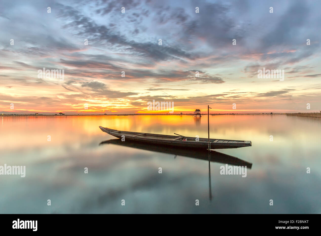 The boat alone in the twilight began to sunset Stock Photo - Alamy