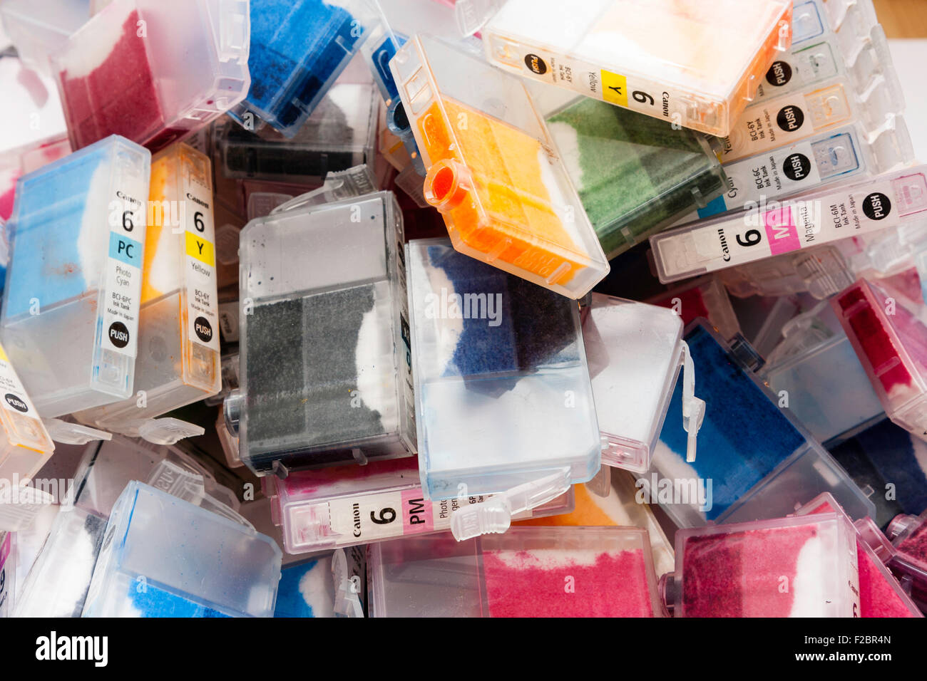 Canon used ink jet plastic cartridges laying scattered in a messy pile ...