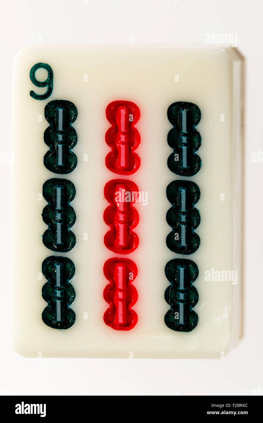 Tile or card from a Mahjong bamboo or bams set, number 9, nine. Close ...