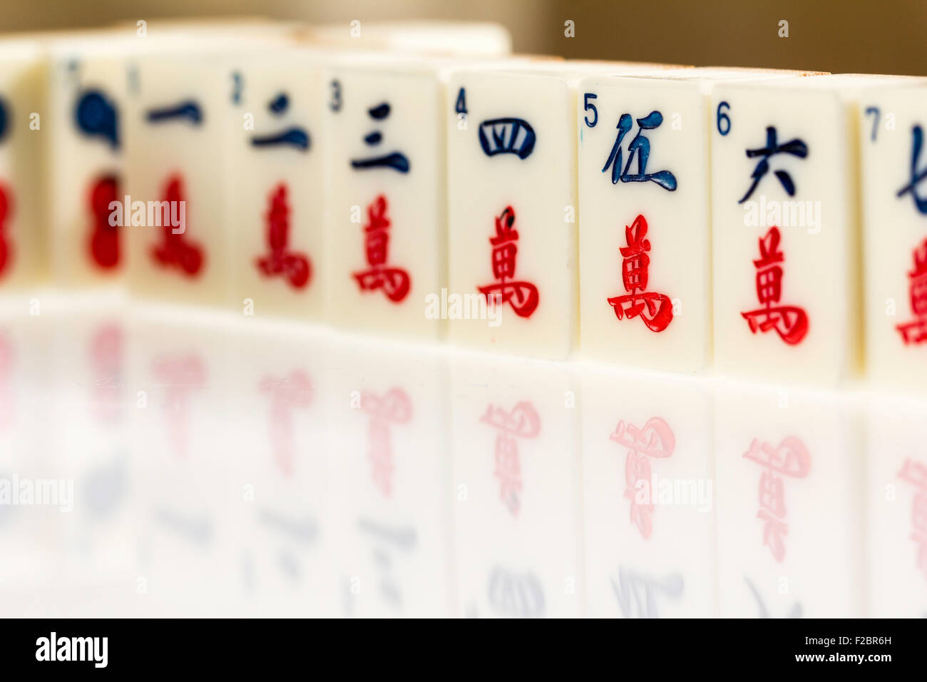 Mahjong set of character cards or tiles, arranged in a line with values ...