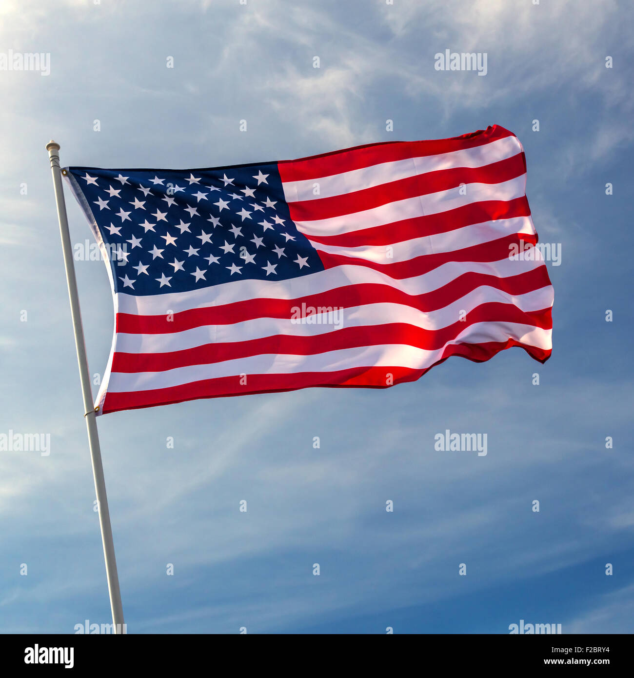 american flag on sky background Stock Photo - Alamy