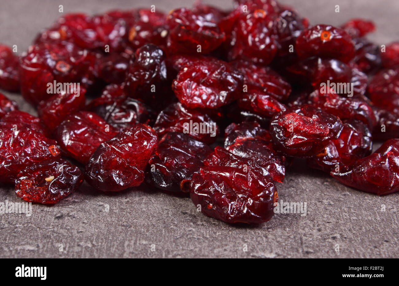 Heap of red cranberries on structure of concrete, concept for healthy ...