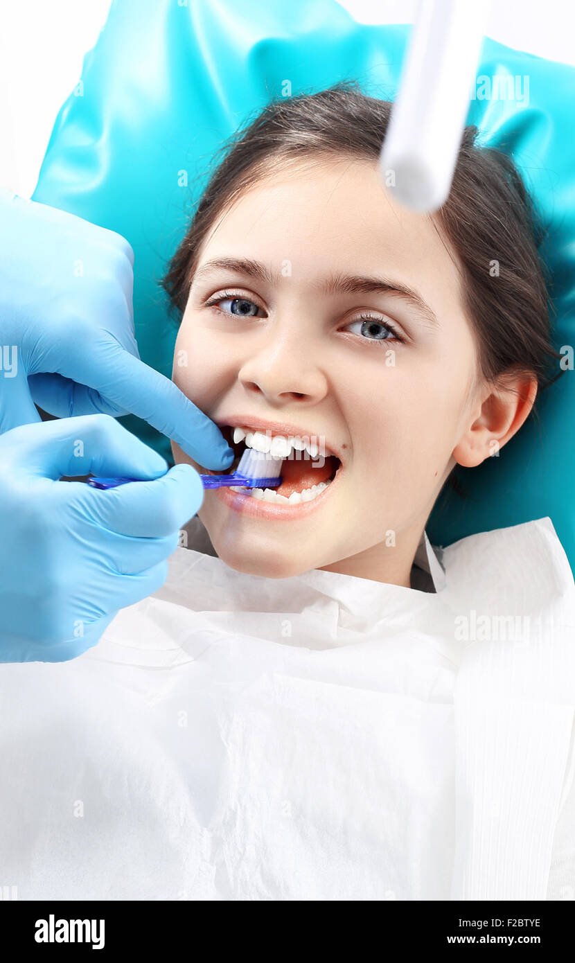 Child in the dental chair dental treatment during surgery Stock Photo ...