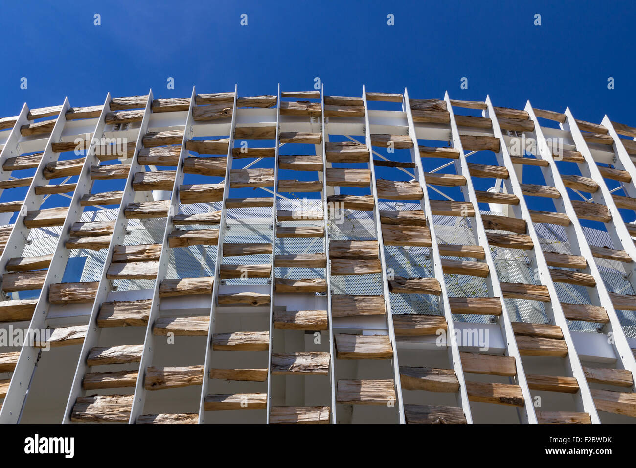 Facade of a building in a contemporary style with inserts of raw wood ...