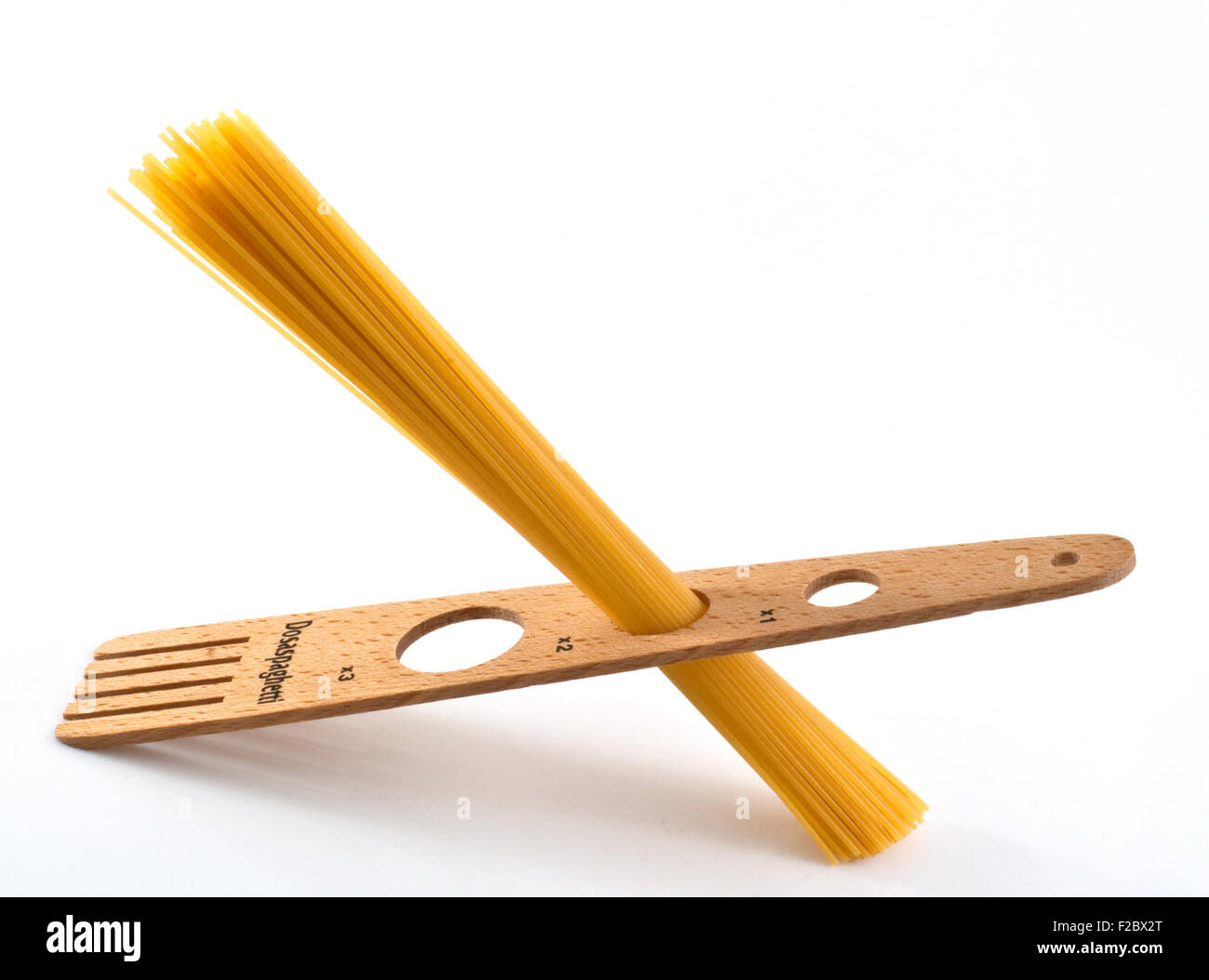 Measurer for spaghetti (Italian Pasta) on white background Stock Photo ...