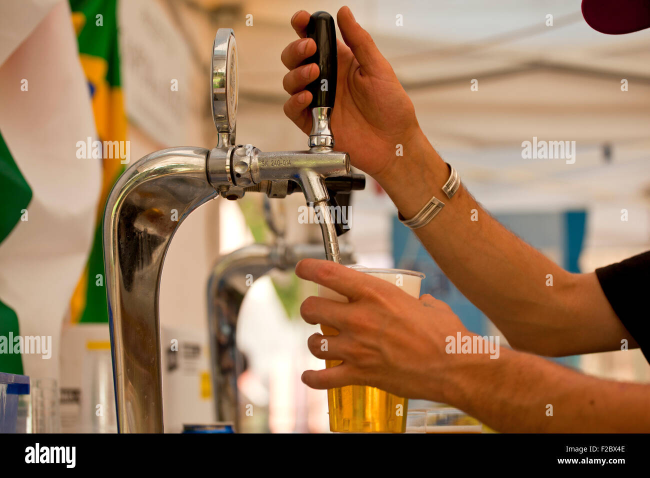 Bartender pouring beer from tap Stock Photo - Alamy