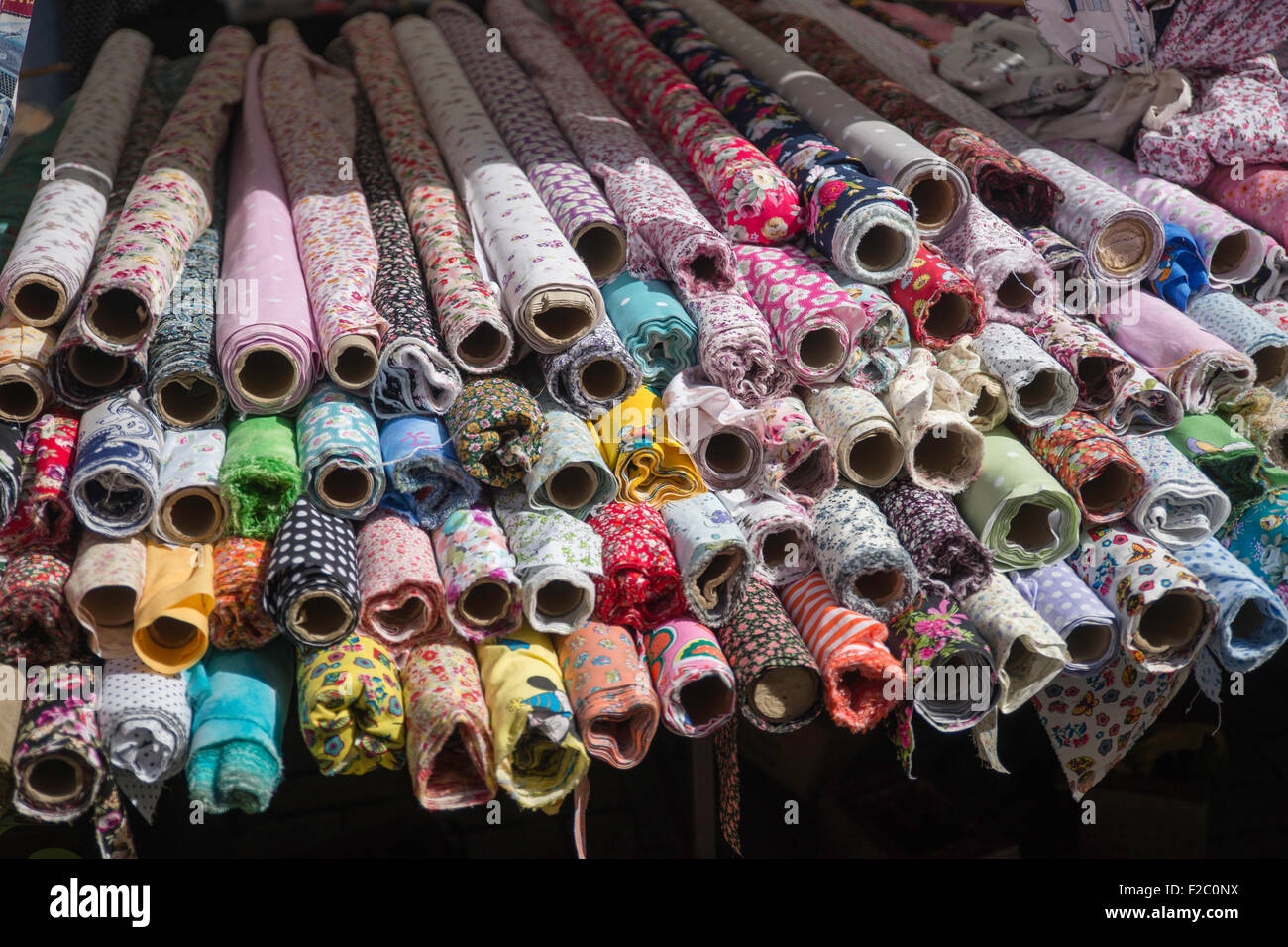 Rolls of coloured material Stock Photo - Alamy