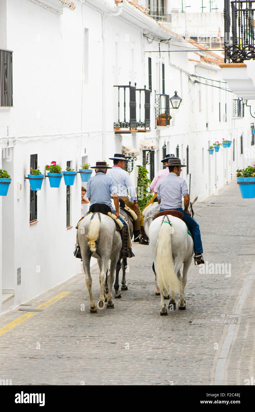 Men on horses wearing Cordobes hats in traditional costume in white ...