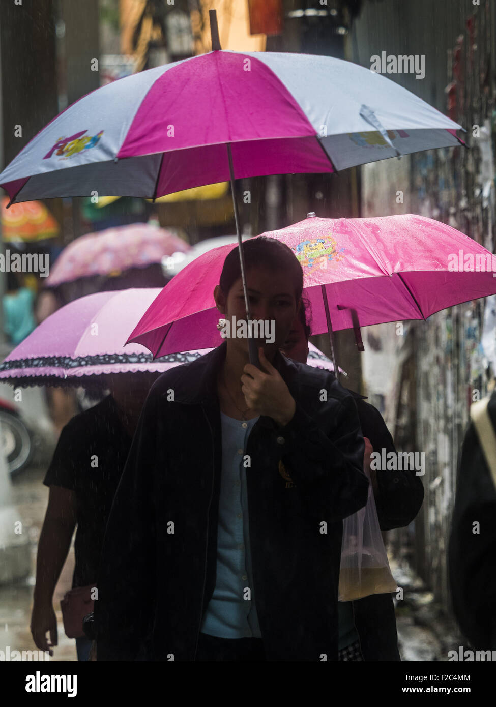 People umbrellas tropical storm hi-res stock photography and images - Alamy