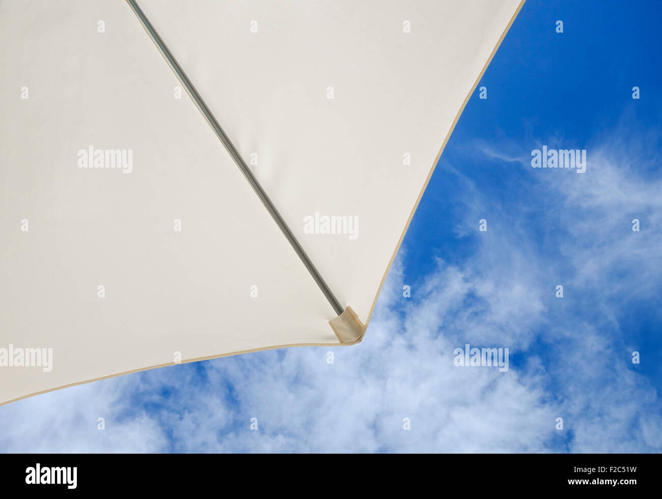 From under a Parasol with blue sky and clouds in background Stock Photo ...