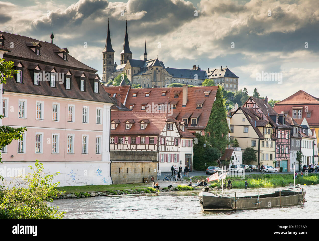 BAMBERG, GERMANY - SEPTEMBER 4: Tourists at the river Regnitz below ...