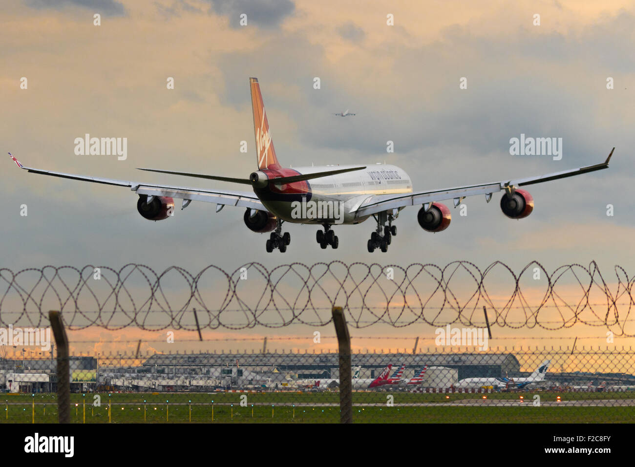 A Virgin Atlantic Airbus A340 prepares to land on runway 27R at London ...