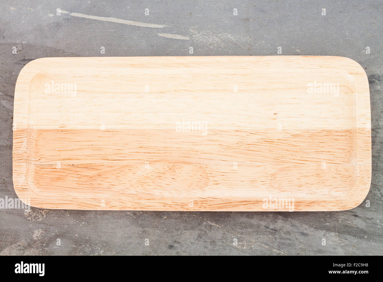 Wooden plate on grey background, stock photo Stock Photo - Alamy
