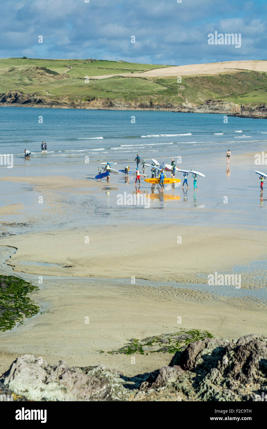 Surf school headed for the water. View of Polzeath/Hayle Bay, North ...