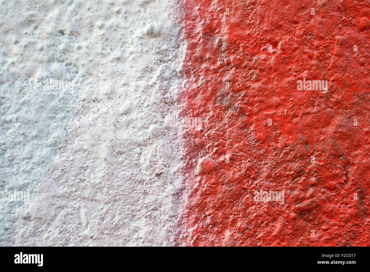 Red color on a white wall Stock Photo - Alamy