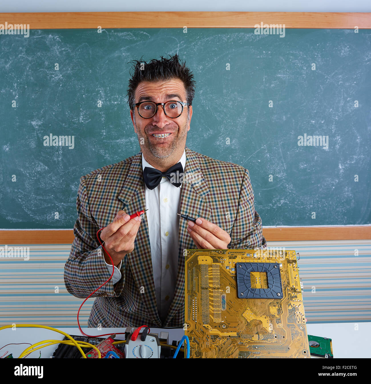 Nerd electronics technician retro teacher silly expression working in ...