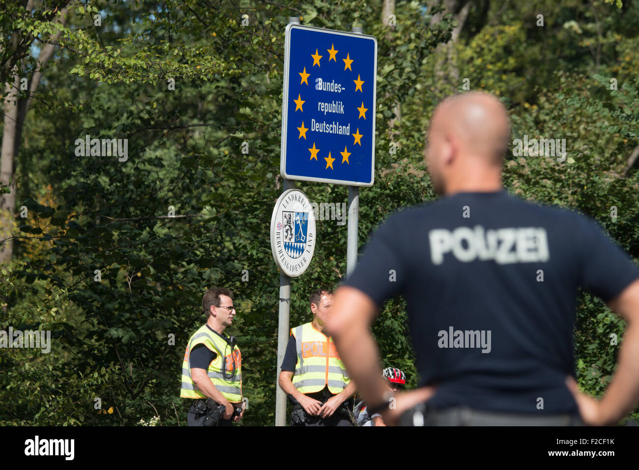 German Federal Police stand under a German Federal Republic sign near ...