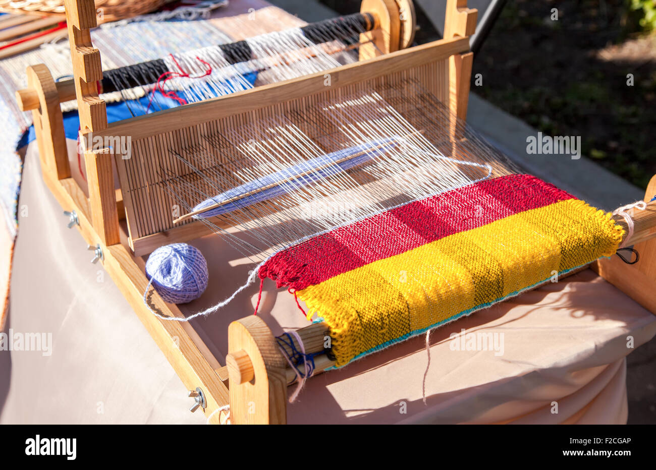 Russian national crafts. Traditional homemade loom Stock Photo - Alamy