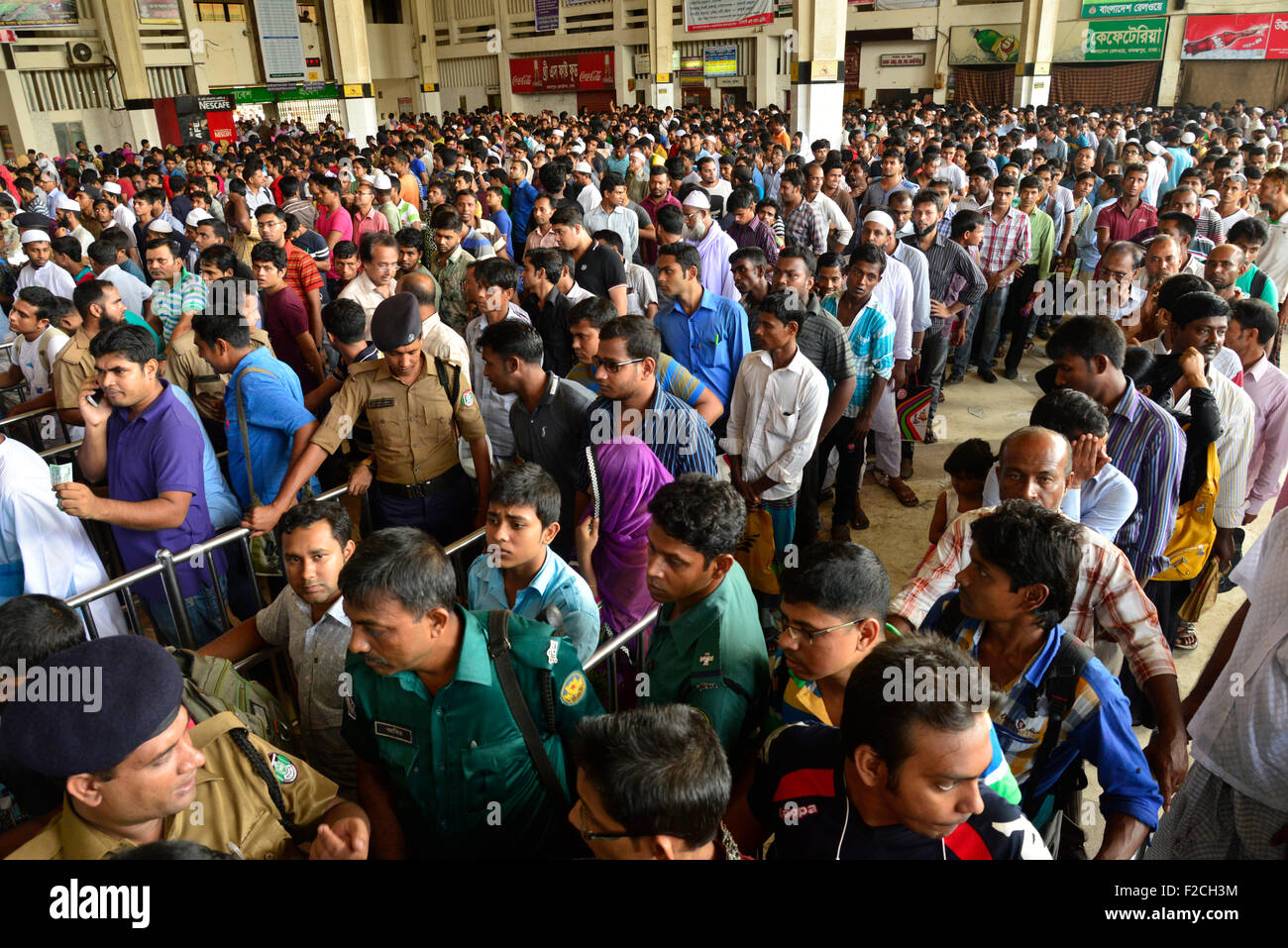 Dhaka, Bangladesh. 16th September, 2015. People stand in queues in ...