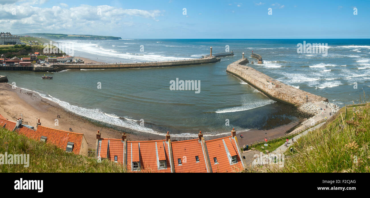 The piers of Whitby Harbour with Sandsend Bay beyond. From the ...
